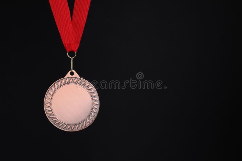 Bronze Medal with Red Ribbon on Black Background, Space for Text Stock ...