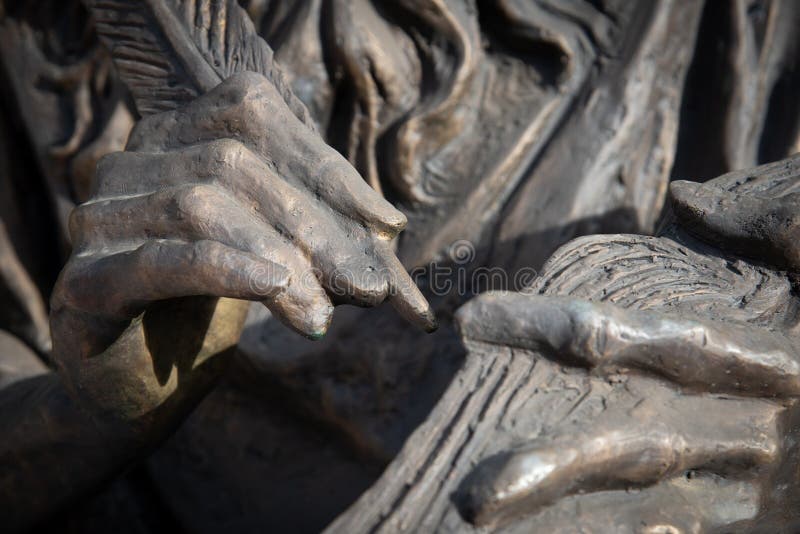 Bronze Sculpture of Hands Holding a Feather Pen and Writing on a Paper ...