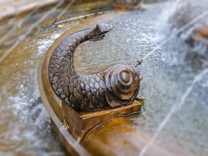 Bronze Shape of Fish with Water Shooting from Mouth Stock Image - Image ...