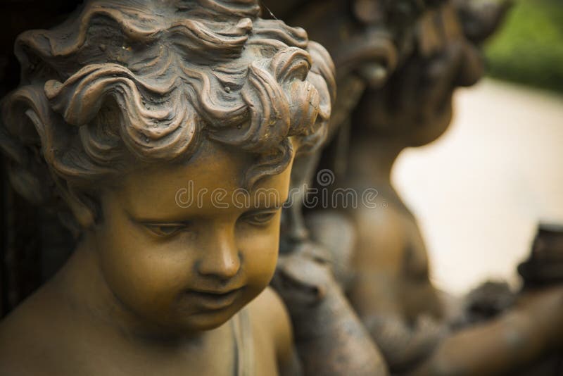 Bronze Statue of the Face of a Curly Haired Child Stock Image - Image ...