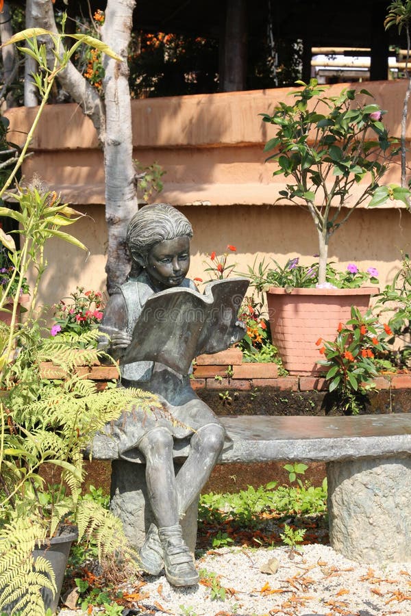 Girl Reading Book Bronze Statue Photos - Free & Royalty-Free Stock ...