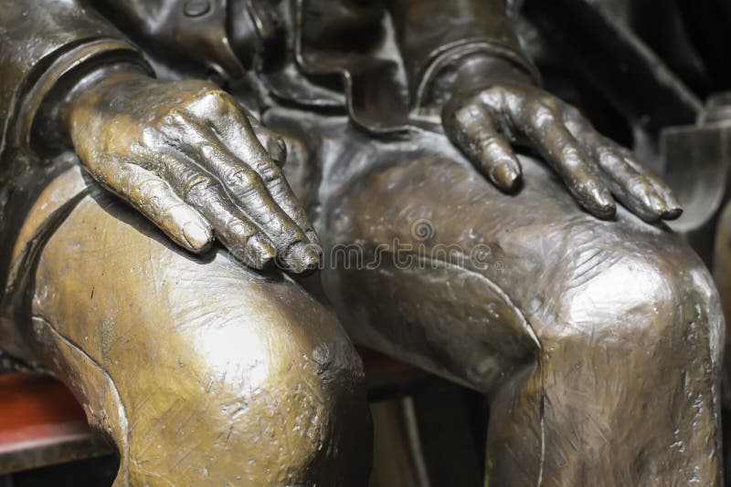 Bronze Statue Men Hands On Leg. Stock Photo - Image of male, closeup ...