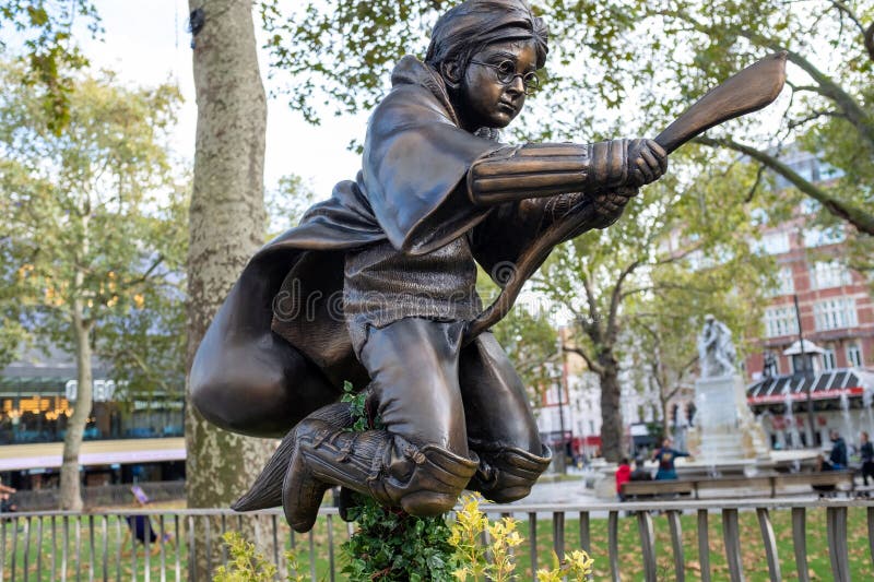 A Bronze Statue of a Young Wizard Riding a Broomstick. Central London ...