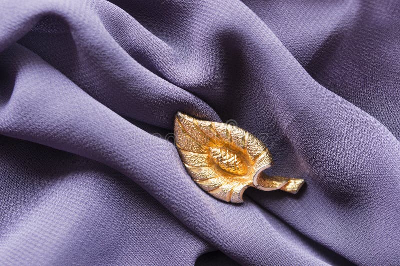 Brooch on silk stock image. Image of bijouterie, folded - 80625077