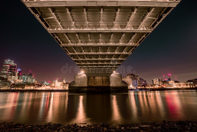 Brooklyn Bridge Base Over the East River with Long Exposure at Night in ...