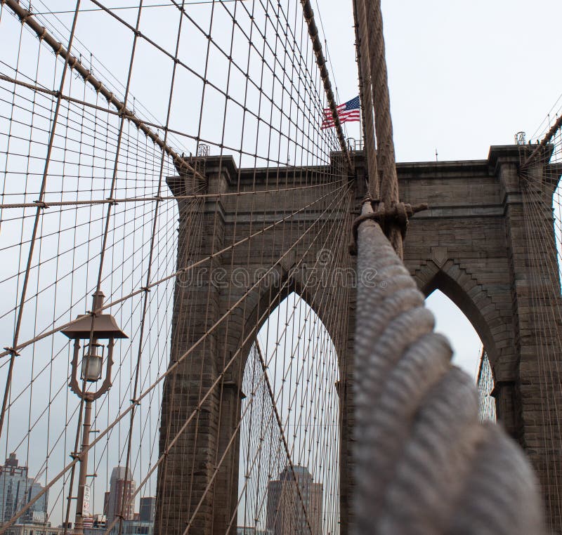 Brooklyn Bridge from the Rope with the American Flag Stock Image ...
