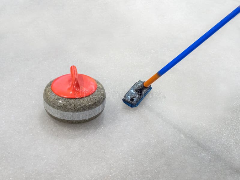 Broom and Stone for Curling on Ice of a Indoors Rink. Stock Photo ...