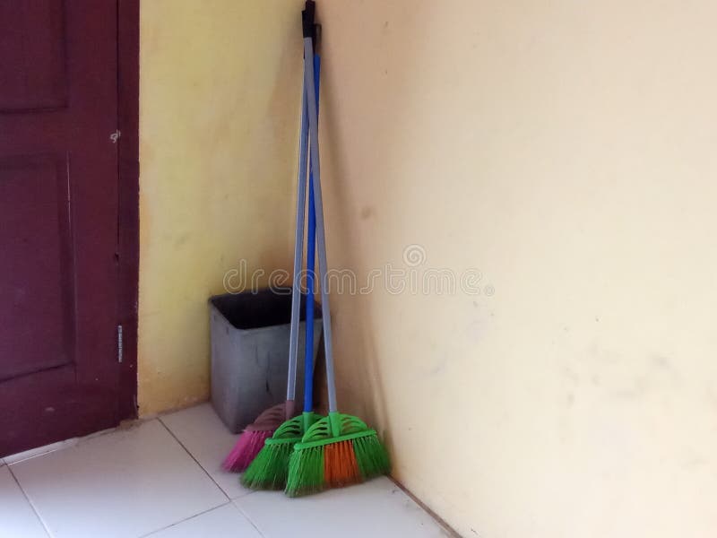 3 Brooms and a Trash Can in the Corner of the Classroom Stock Photo ...