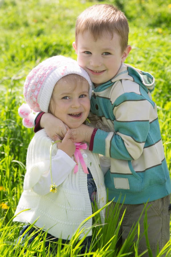 Brother Giving Hug To Sister Outdoors Stock Photo - Image of siblings ...
