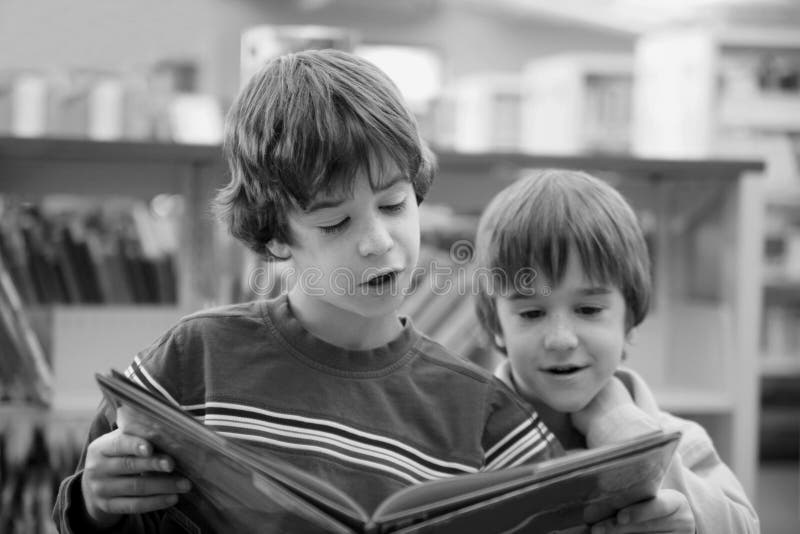 Brother Reading a Book stock image. Image of childhood - 3624399