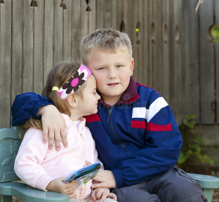 Brother and Sister Cuddling Stock Photo - Image of countryside, people ...