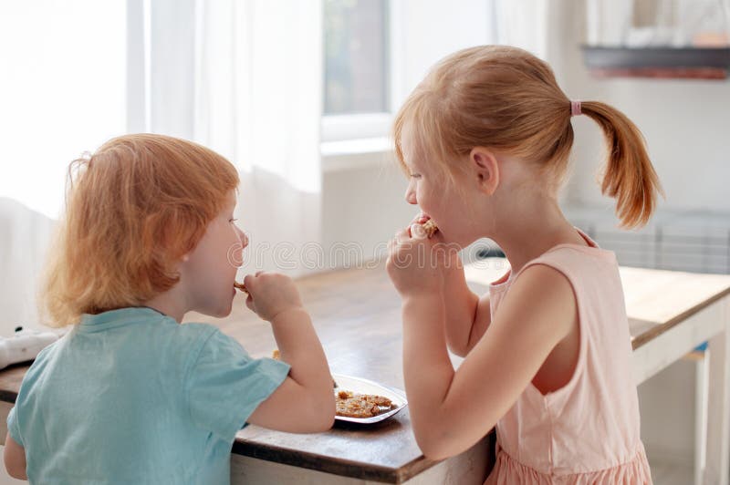 Children Eat Pie at the Table in the Kitchen Stock Image - Image of ...