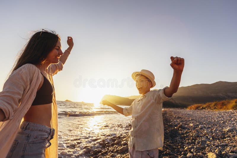 Brother and Sister are Having Fun on the Beach. Stock Image - Image of ...