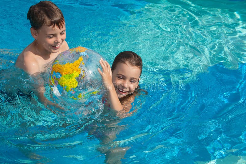 Brother Sister Having Fun Playing in Pool Stock Photo - Image of pool ...