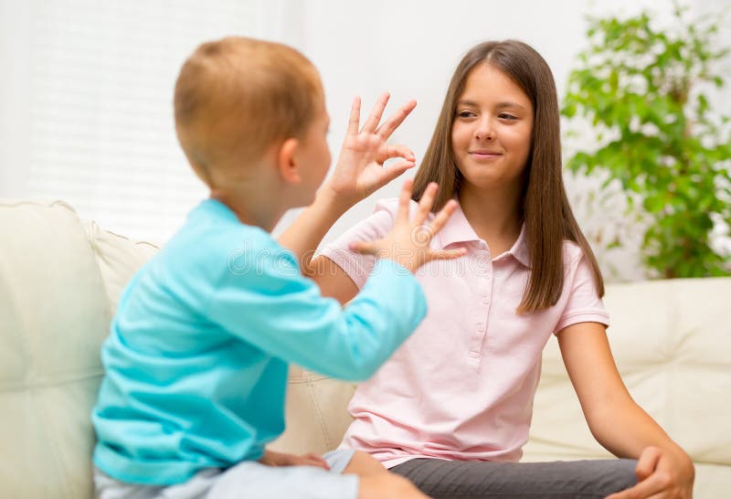 Brother and Sister Learn Sign Language Stock Photo - Image of brother ...