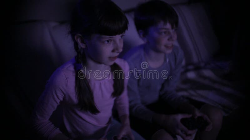 Brother And Sister Play A Computer Game With Joysticks Stock Video