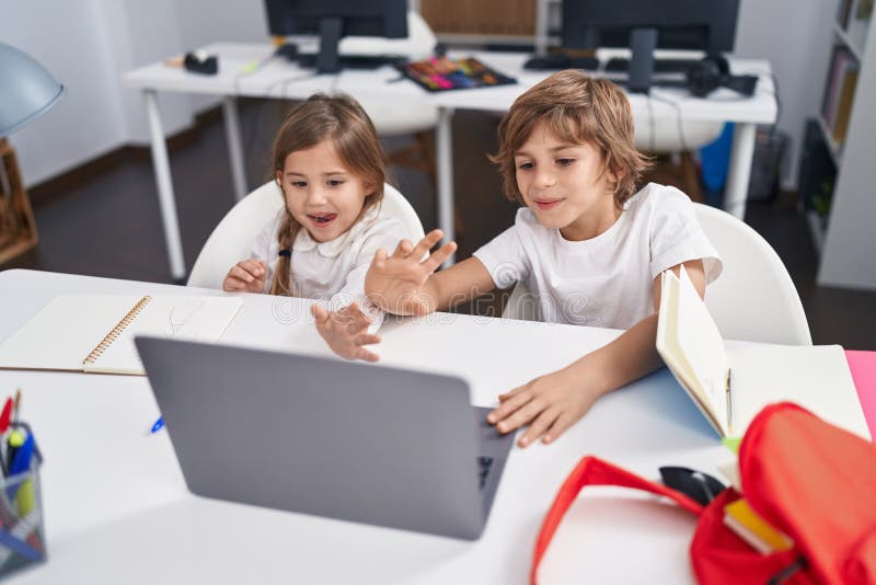 Brother and Sister Students Having Long Distance Education at Classroom ...