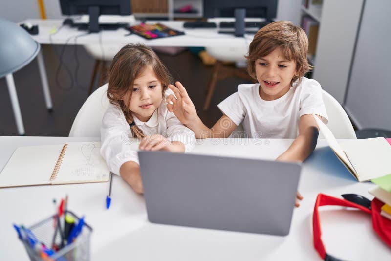Brother and Sister Students Having Long Distance Education at Classroom ...