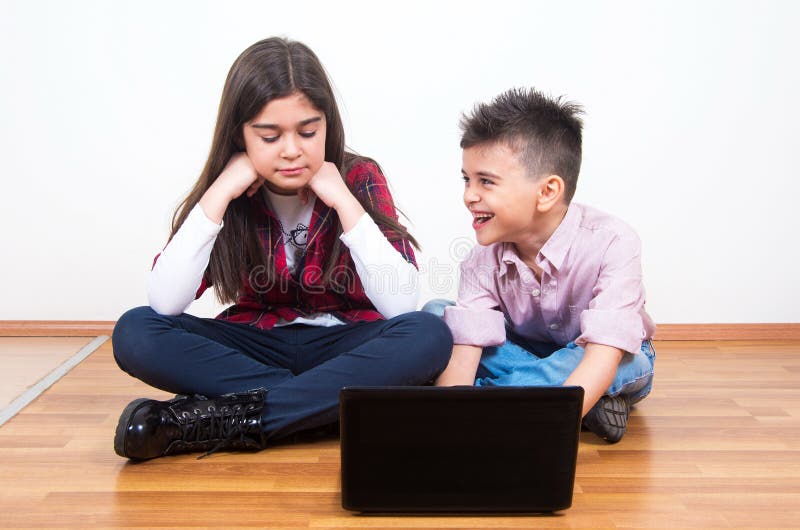 Brother and Sister Using Laptop Stock Photo - Image of elegant, child ...