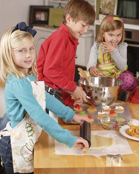Brother and Sisters Cooking Stock Image - Image of caucasian, buns ...