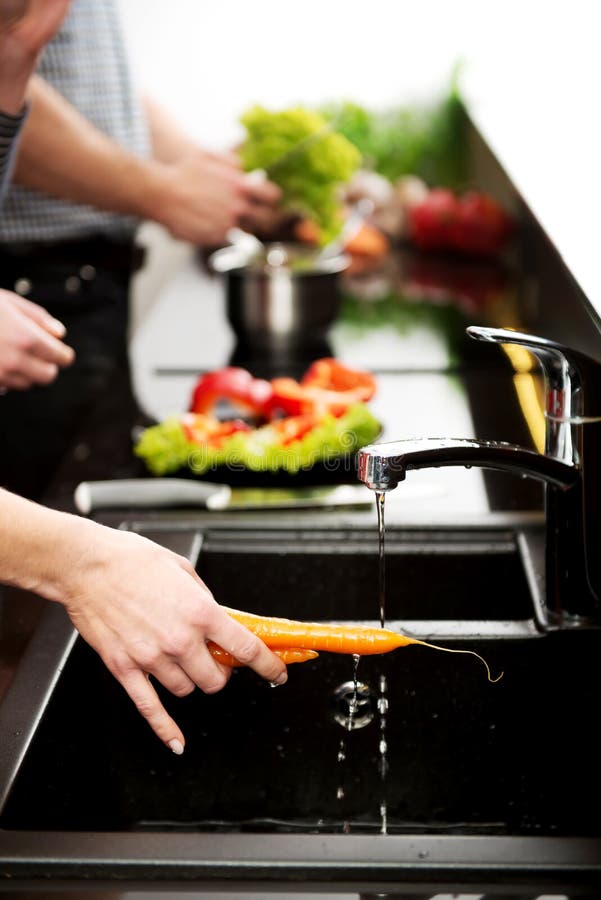 Brother and Sisters Cooking Meal Together. Stock Photo - Image of group ...