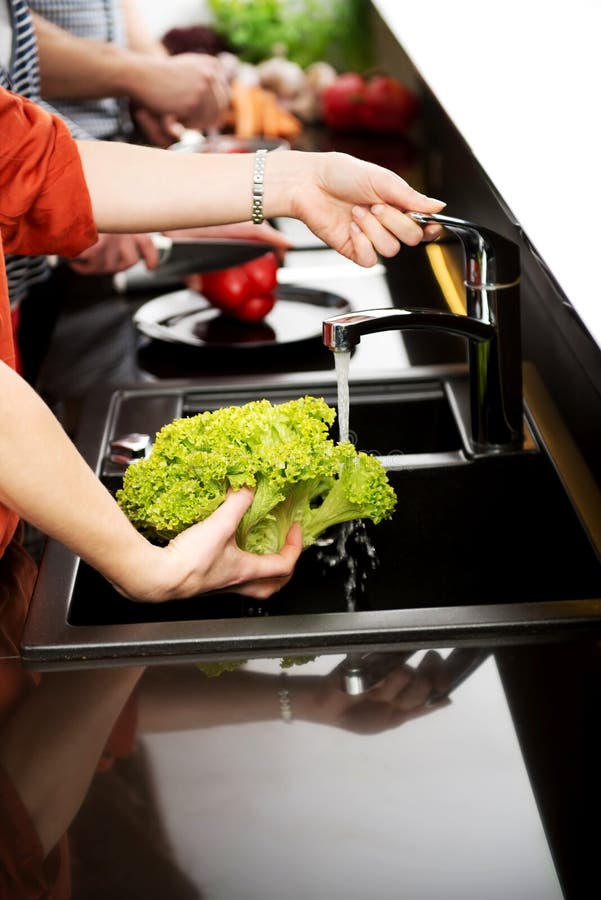 Brother and Sisters Cooking Meal Together. Stock Photo - Image of home ...
