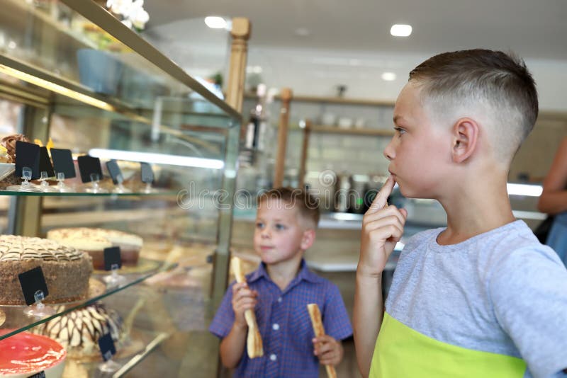Brothers choosing cake stock image. Image of customer - 160995955
