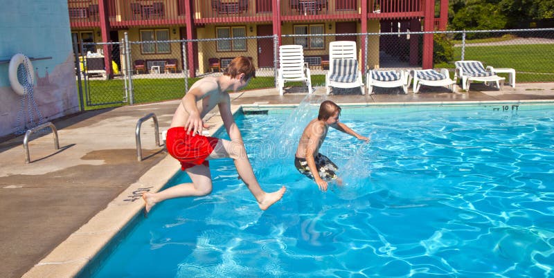 Boy Jumping into Swimming Pool Stock Photo - Image of hotel, playful ...