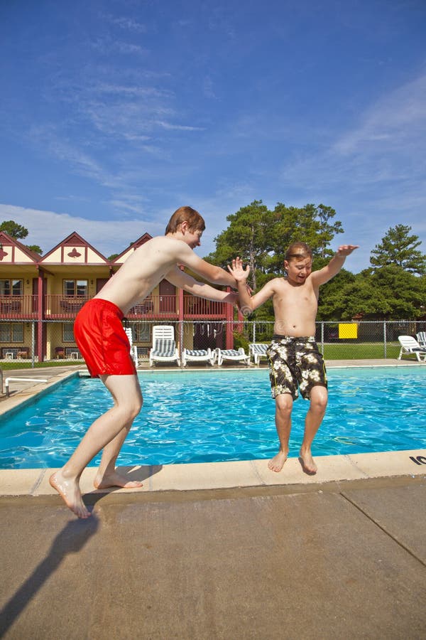 Brothers Having Fun at the Pool Stock Photo - Image of fresh, jumping ...