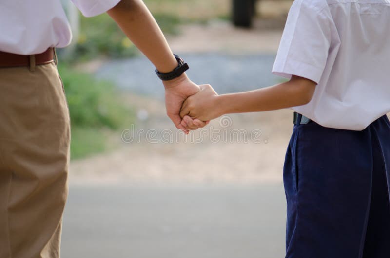 Brothers Holding Hands Went Ahead with Concern and Ties. Happy Stock ...