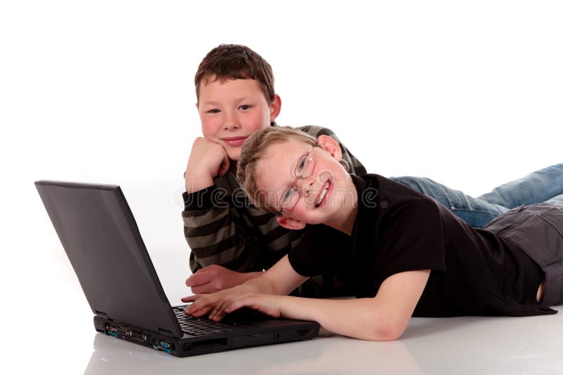 Brothers Working on Laptop Computer Sitting on Floor Stock Photo ...