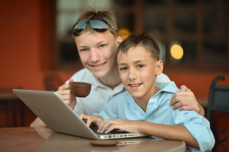 Brothers with laptop stock photo. Image of child, happiness - 51719388