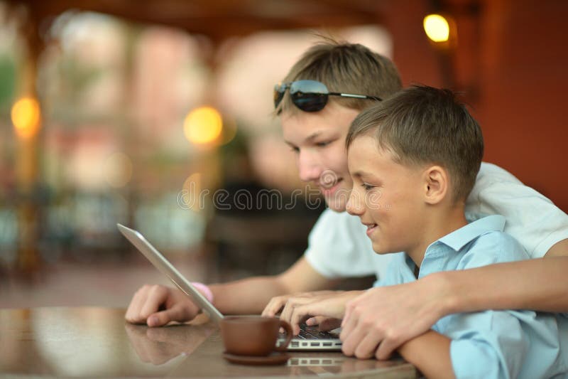 Brothers with laptop stock image. Image of childhood - 52039561