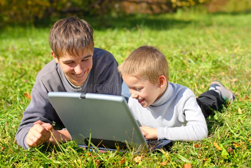 Brothers with notebook stock photo. Image of child, autumn - 11815970