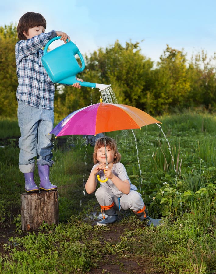 Brothers Play in Rain Outdoors Stock Image - Image of instagram, nature ...