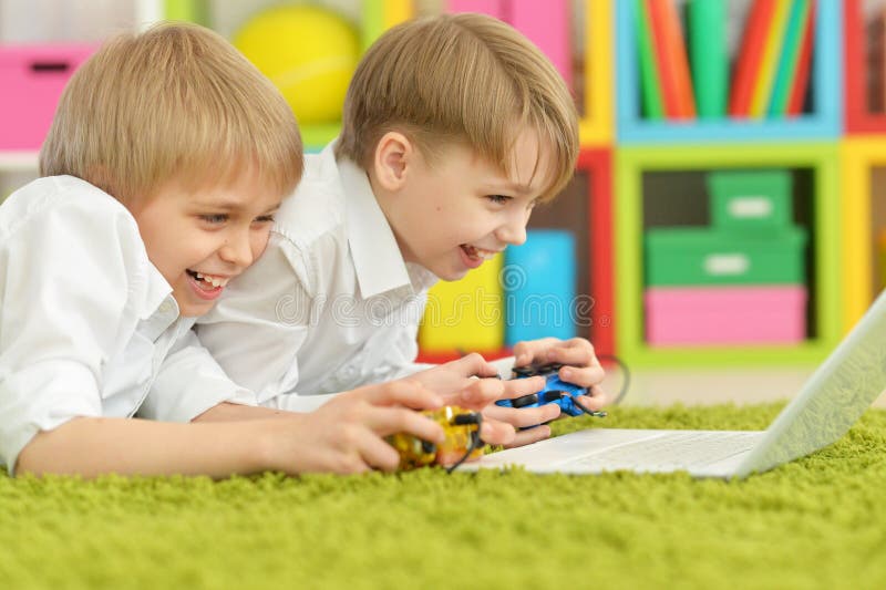 Brothers Playing a Computer Game Stock Photo - Image of cheerful, happy ...