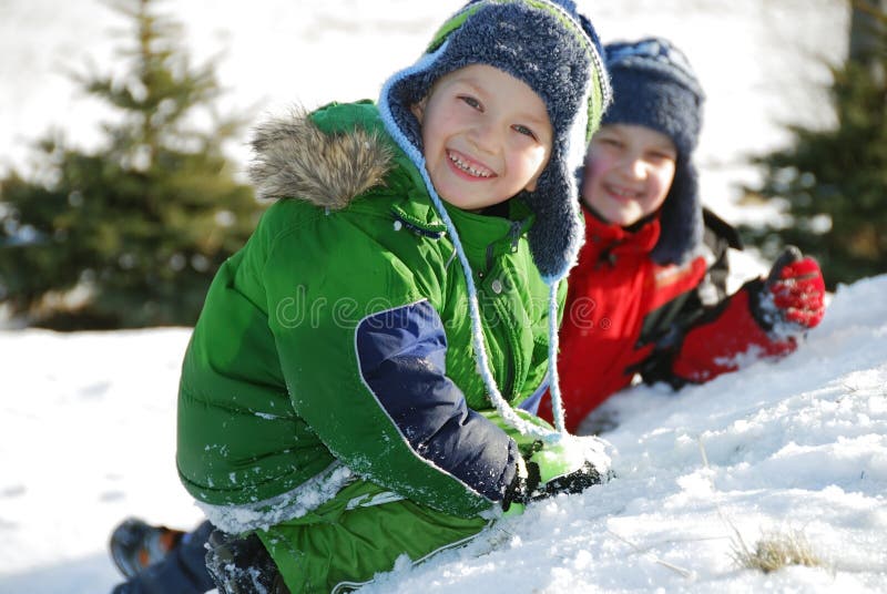 Boys in snow stock photo. Image of playing, children, cute - 4075150