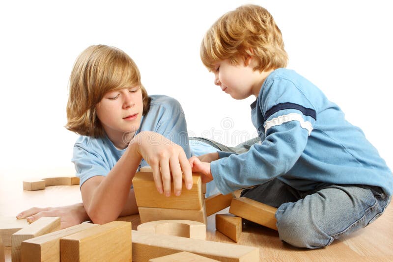 Brothers playing together stock photo. Image of learning - 7442548