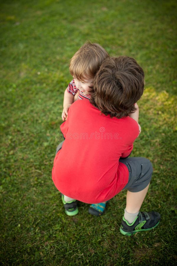 Brothers playing together stock photo. Image of family - 31334386