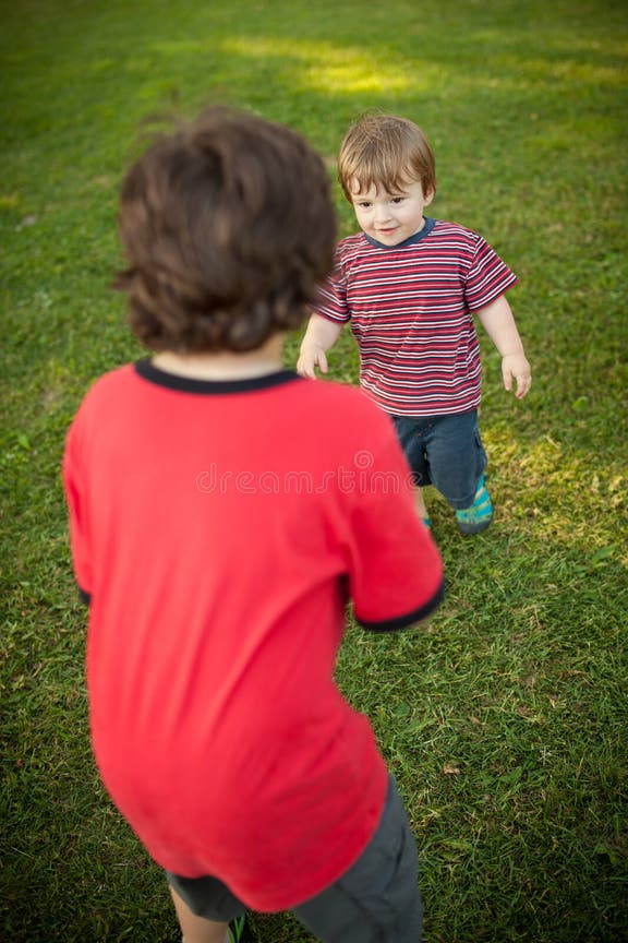 Brothers playing together stock photo. Image of family - 31334394