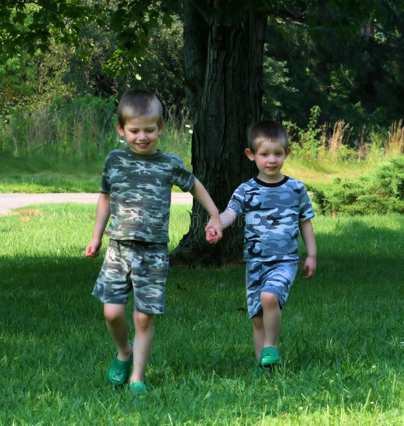 Two Brothers On A Grass Picture. Image: 3182299
