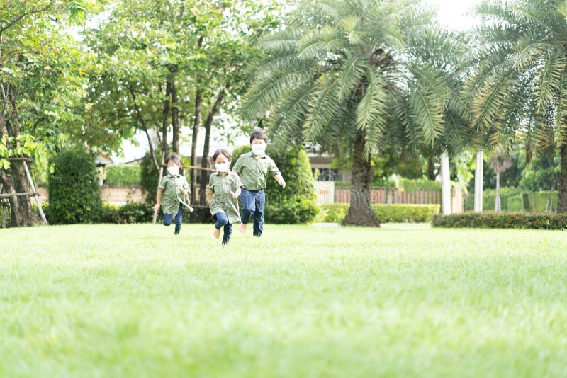 3 Brothers are Running and Playing in the Garden Stock Image - Image of ...