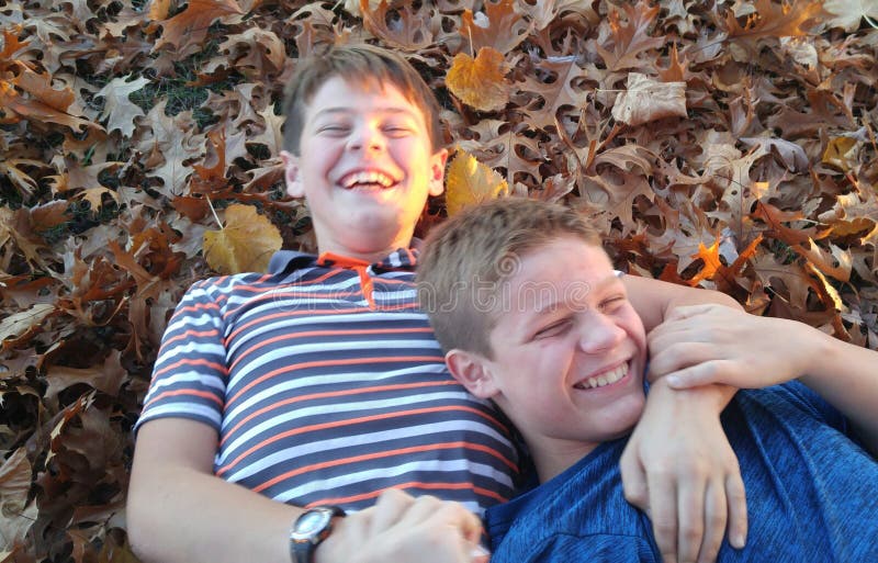 Brothers Sharing a Laugh in the Fall Stock Image - Image of fall, laugh ...