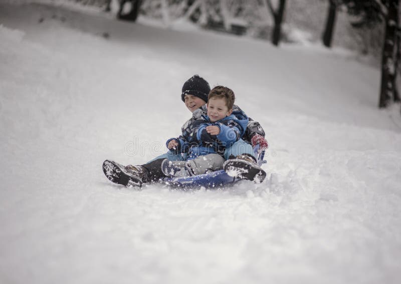 Brothers Sledging Down the Hill Stock Photo - Image of nature, activity ...