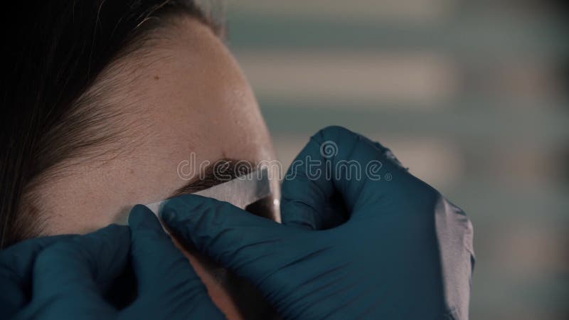Brow Master Waxing the Brow Bone of Young Woman Stock Footage - Video ...