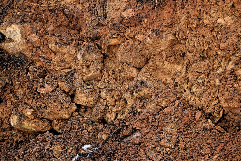 Clay surface with stones. stock photo. Image of material - 173607092