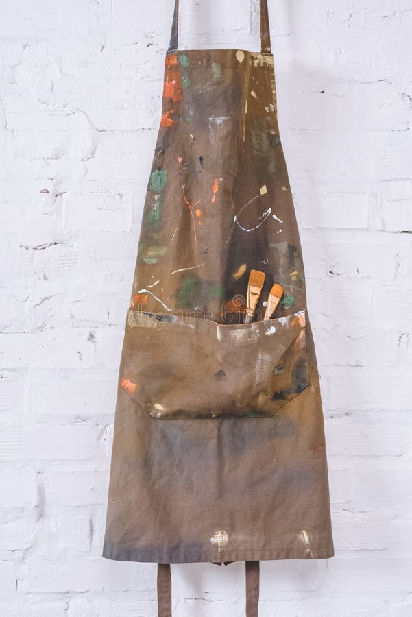 Brown Apron with Paint Brushes Hanging Stock Image - Image of artistic ...