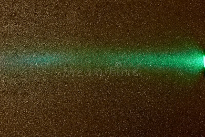 On a Brown Background in a Fine Grain of Light Green Ray of Light Stock ...