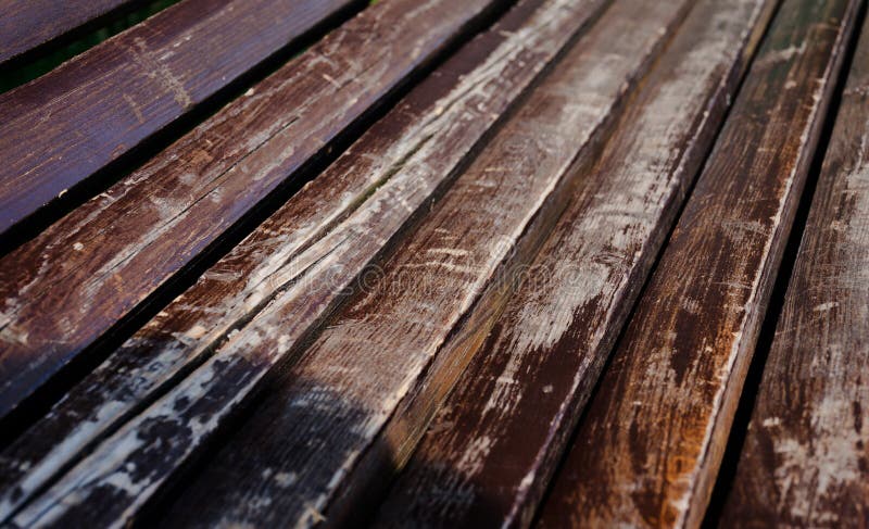 Brown bench closeup stock photo. Image of bokeh, bench - 61914706