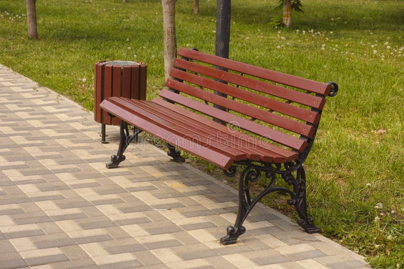 Brown bench in the park stock photo. Image of seat, tree - 319599800